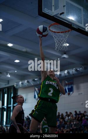 A Harlem Globetrotters player dunks a basketball at Ramstein Air Base ...