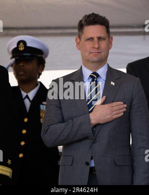 Russell Rumbaugh, wearing a grey suit, was one of several distinguised ...