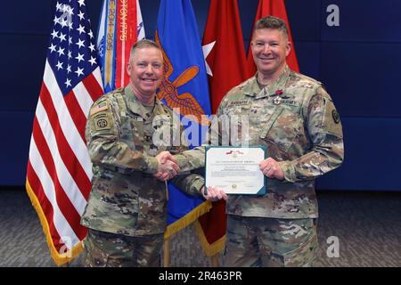 Brig. Gen. Michael C. McCurry and his wife Sadie receive an update from ...