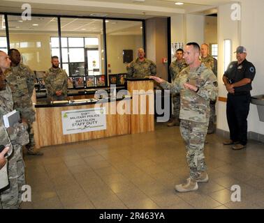 Col. Sam Smith, garrison commander, shakes hand after acknowledging ...