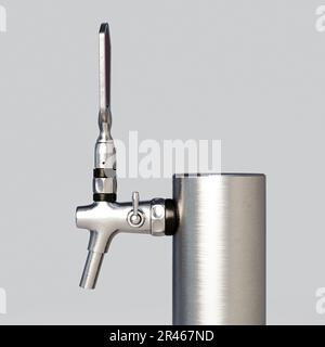 A concept draught beer tap made of a cylindrical shape with steel ...