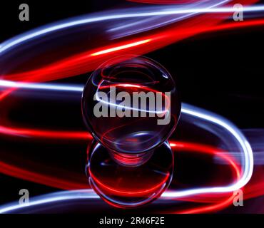 An intriguing red light emanating from a light bulb in a dimly lit ...