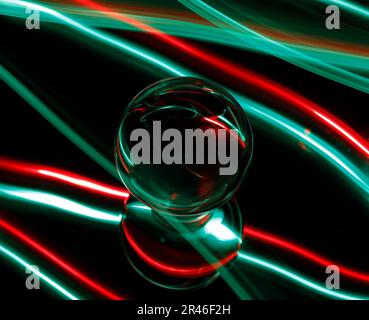An intriguing green and red light emanating from a light bulb in a ...