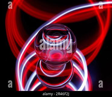 An intriguing red light emanating from a light bulb in a dimly lit ...