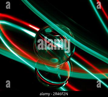 An intriguing green light emanating from a light bulb in a dimly lit ...