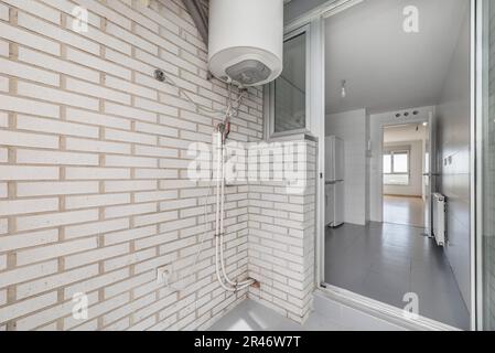 A small closed terrace to use as a laundry room Stock Photo - Alamy