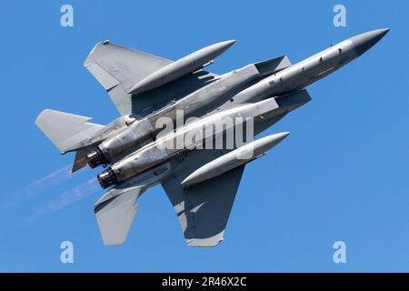 A fighter jet soaring through a bright blue sky Stock Photo - Alamy