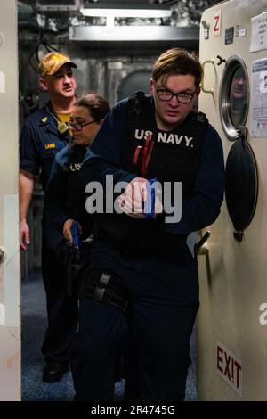 SINGAPORE (March 7, 2023) Engineman 2nd Class Adrian Belt, from Spokane ...