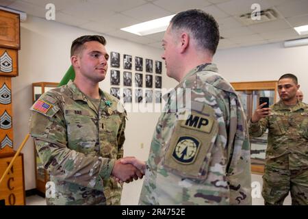 Army 1st Lt. Kevin Rae (right), a Soldier with 385th Military Police ...