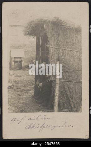 Unidentified German soldiers in latrine with straw covering Stock Photo ...