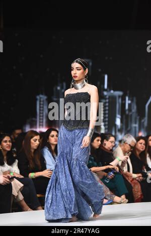 Karachi, Pakistan. 26th May, 2023. Models present creations during a ...