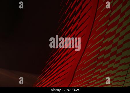 A large display featuring a pattern of red and yellow lights radiating ...