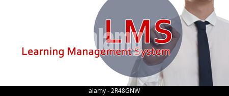 Learning management system. Businessman writing abbreviation LMS on ...