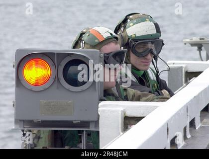 US Navy A bow safety watch stander observes an F-A-18C assigned to the ...