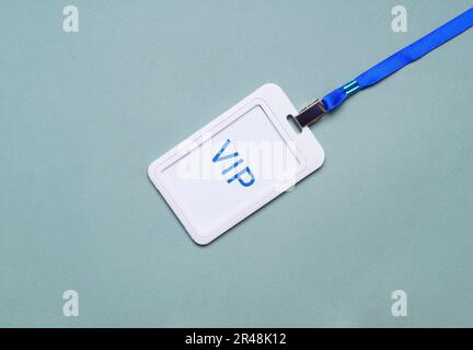 Plastic vip badge on light blue background, top view. Space for text ...