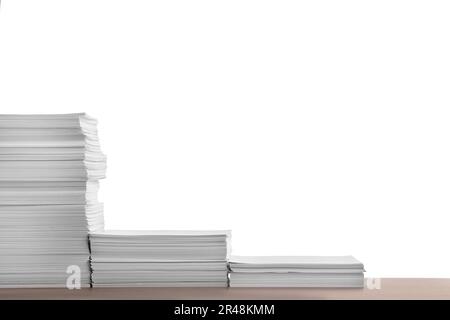 Stacks of paper sheets on white background Stock Photo - Alamy
