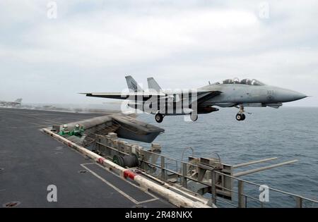 A Fighter Squadron 143 (VF-143) F-14B Tomcat aircraft flies over the ...