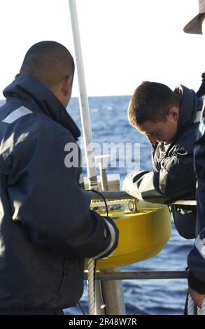 US Navy Sailors deploy probes used during a test of the Integrated ...