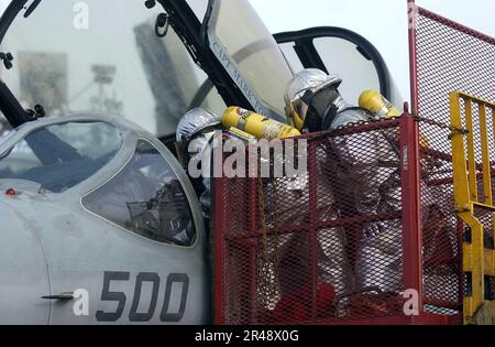 US Navy Crash and Salvage Rescue Team carries an injured sailor on a ...