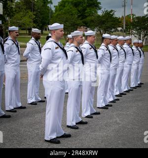 Sailors assigned to NMOTC headquarters stand in formation during a ...
