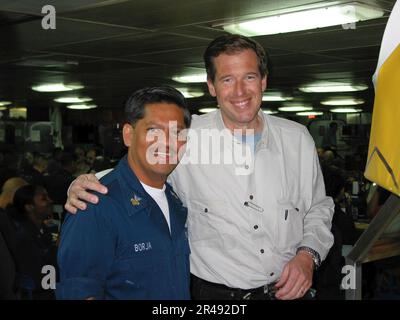US Navy NBC anchorman Brian Williams takes time out to enjoy a meal ...