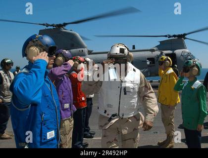 US Navy Rear Adm. W. Clyde Marsh presents a photo of CTF-51 Amphibious ...