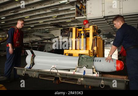 US Navy Aviation Ordnancemen move inert MK-83 1,000 lb training ...