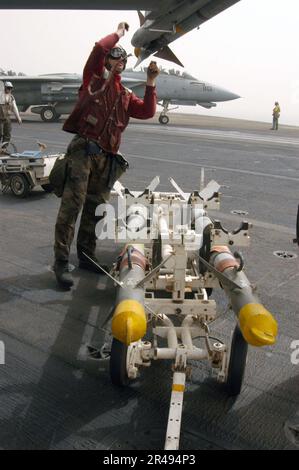 US Navy An Aviation Ordnanceman inspects precision guided ordnance ...