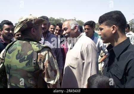 US Navy A member of the Free Iraqi Forces (FIF) is reunited with family ...