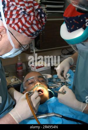 US Navy Cmdr. Navy dentist from the Military Sealift Command (MSC ...