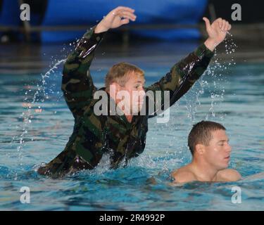 US Navy An instructor at the Navy Basic Underwater Demolition-SEAL ...