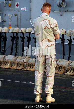 US Marines Brig Gen Richard Simcock salutes a flower wreath in the ...