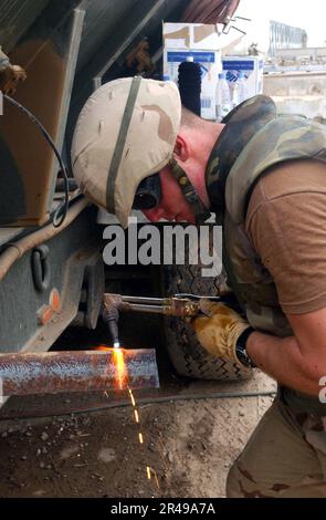 US Navy U.S. Navy Seabee, Construction Mechanic 3rd Class assigned to ...