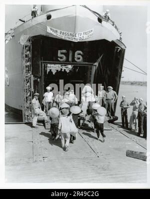 Vietnam: Vietnamese refugees board a US Navy landing craft in Haiphong ...