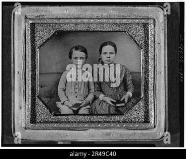 Three-quarter length portrait of unidentified woman dressed with long ...