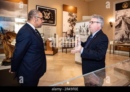 Rod Gainer (right), curator, Arlington National Cemetery, gives a tour ...