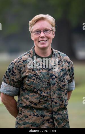 U.S. Marine Corps Col. Karin Fitzgerald, center, the commanding officer ...