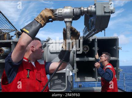 US Navy Fire Control Technician Second Class Tim Hartzog, acts as ...