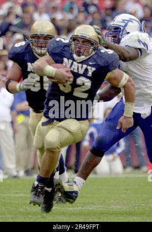 US Navy Navy fullback Kyle Eckel evades a Notre Dame defender Stock ...