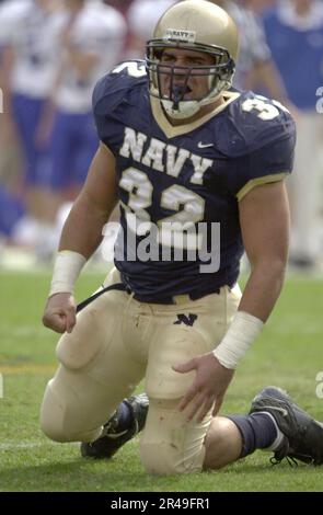 US Navy Navy fullback Kyle Eckel evades a Notre Dame defender Stock ...
