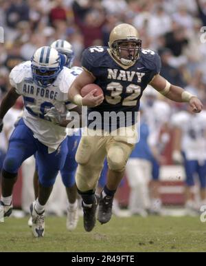 US Navy Navy fullback Kyle Eckel evades a Notre Dame defender Stock ...