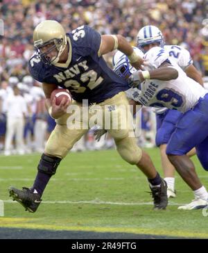 US Navy Navy fullback Kyle Eckel evades a Notre Dame defender Stock ...