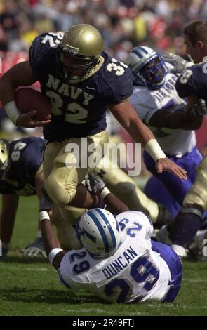 US Navy Navy fullback Kyle Eckel evades a Notre Dame defender Stock ...
