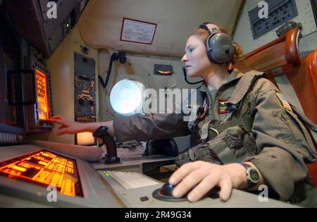 US Navy An Aviation Warfare Systems Operator watches from his door ...