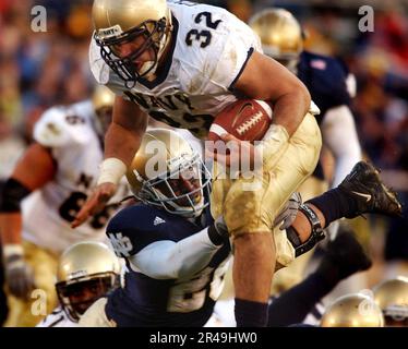 US Navy Navy fullback Kyle Eckel outpaces Air Force free safety Larry ...
