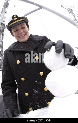 US Navy Midshipman 4th Class fires an M-14 rifle, attached with an MK ...