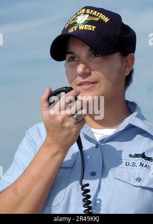 US Navy Quartermaster 1st class prepare charts for a transit through ...