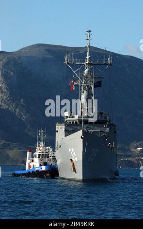 US Navy USS Doyle (FFG 39) is assisted by Greek tugs as she arrives for ...