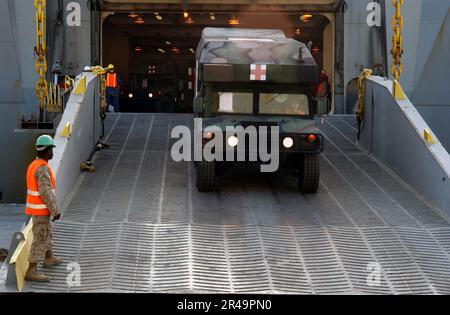 US Navy A Marine High Mobility Multi-purpose Wheeled Vehicle drives ...