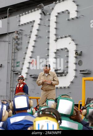 US Navy Aircraft handler, Cmdr. Joe Amper (left), of Manilla ...